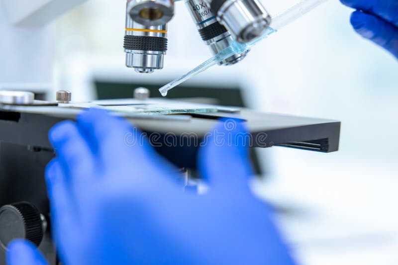 Unknown Scientist Working in Science Laboratory Microscoping ...