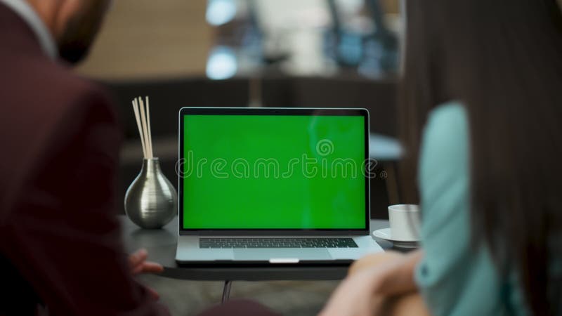 Unknown Team Using Green Screen Laptop at Lobby Closeup. Coworkers ...