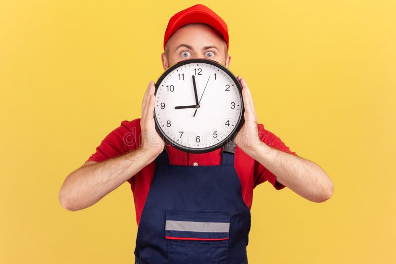 Unknown Worker Man Covering Half of Face Behind Big Wall Clock, the ...