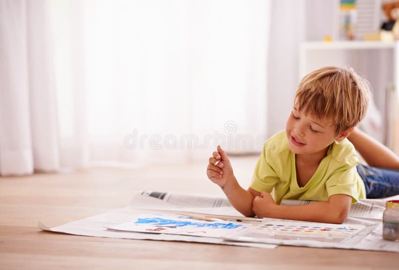 Unleash Your Childs Creativity. a Cute Little Boy Painting a Picture at ... Unleash Your Childs Creativity. a Cute Little Boy Painting a Picture at ...