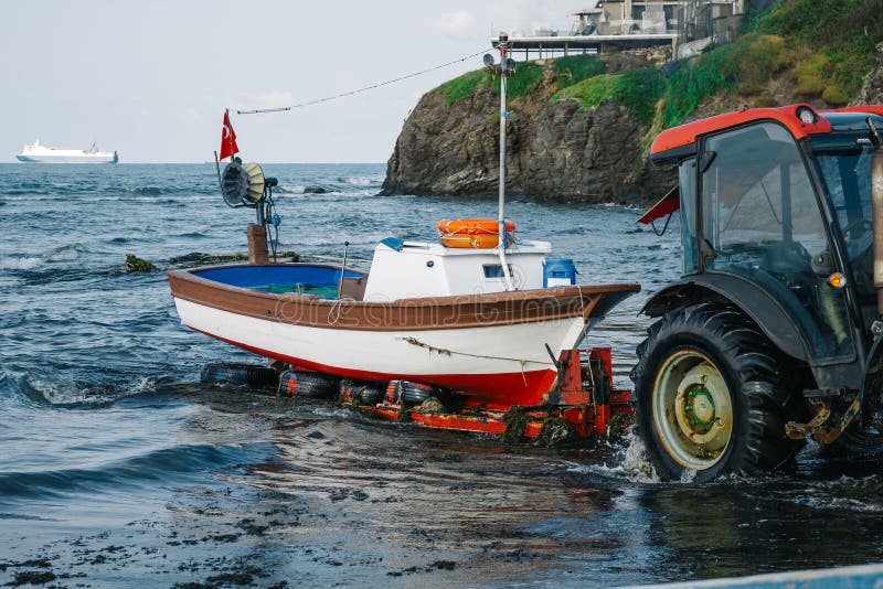 Unloading the Boat on the Shore. Pulling the Boat To the Beach for ...