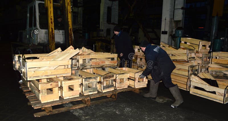 Unloading Boxes for Packaging Finished Products. Editorial Stock Photo ...
