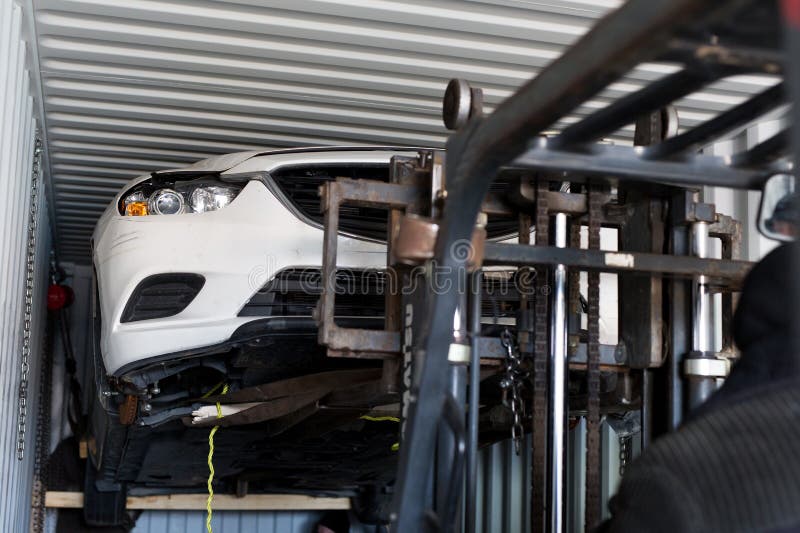 Unloading the Car from the Transport Container. Stock Photo - Image of ...