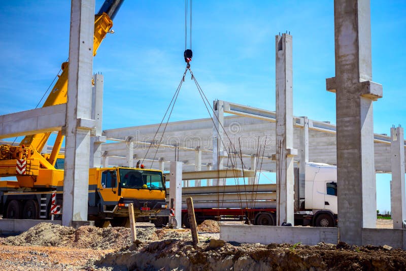 Unloading Concrete Pillar from Truck Trailer at Construction Site Stock ...
