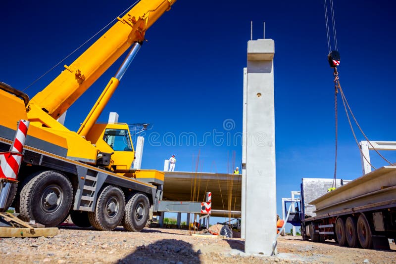 Unloading Concrete Pillar from Truck Trailer at Construction Site Stock ...