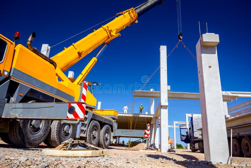 Unloading Concrete Pillar from Truck Trailer at Construction Site Stock ...