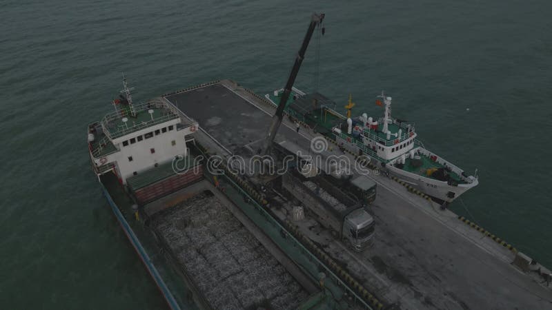 Unloading a Dry Cargo Ship with Bales Using a Mobile Crane. Stock Video ...