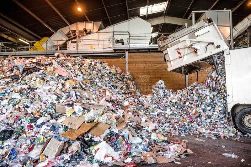 Unloading a Dump Truck of Waste into a Storage Room before Recycling ...