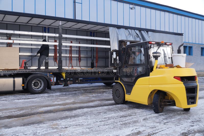 Unloading Goods from a Truck with a Forklift. Transport Stock Image ...