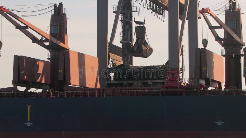 Unloading a huge coal ship stock footage. Video of industry - 164517640