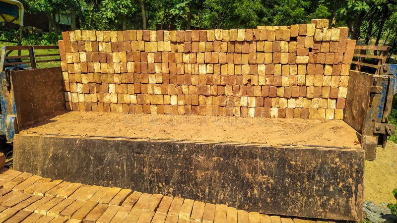Unloading the Loaded Bricks on the Tractor Trolley. Stock Image - Image ...