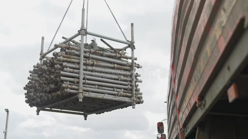Crane Unloading Mechanism with Chains and Hooks. Unloading ...