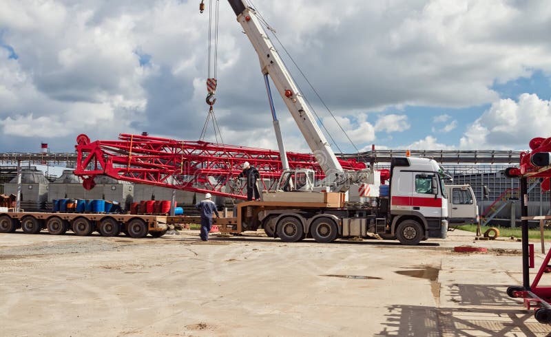 Unloading Sections of the Boom of a Large Crawler Crane Using a Crane ...