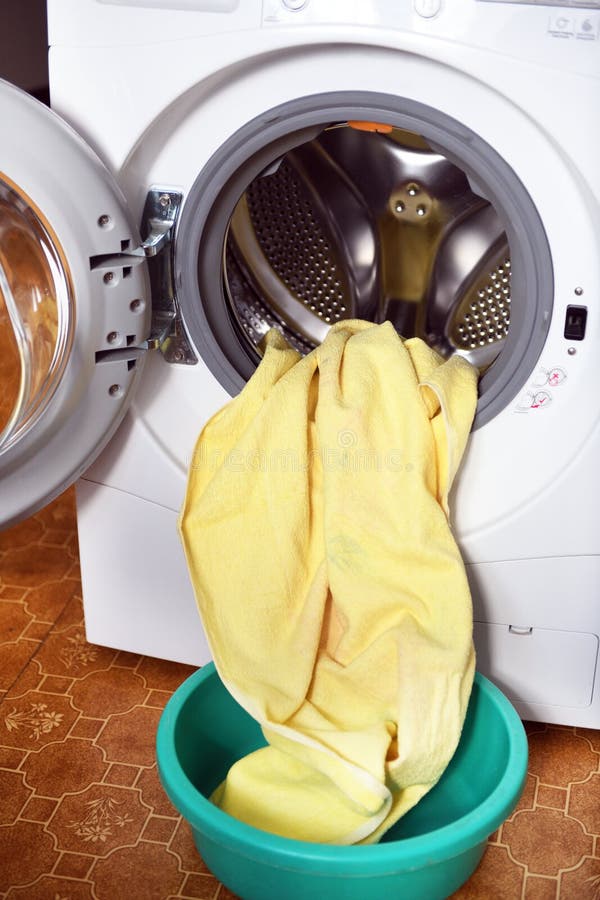 Unloading Things from the Washing Machine. Stock Image - Image of color ...