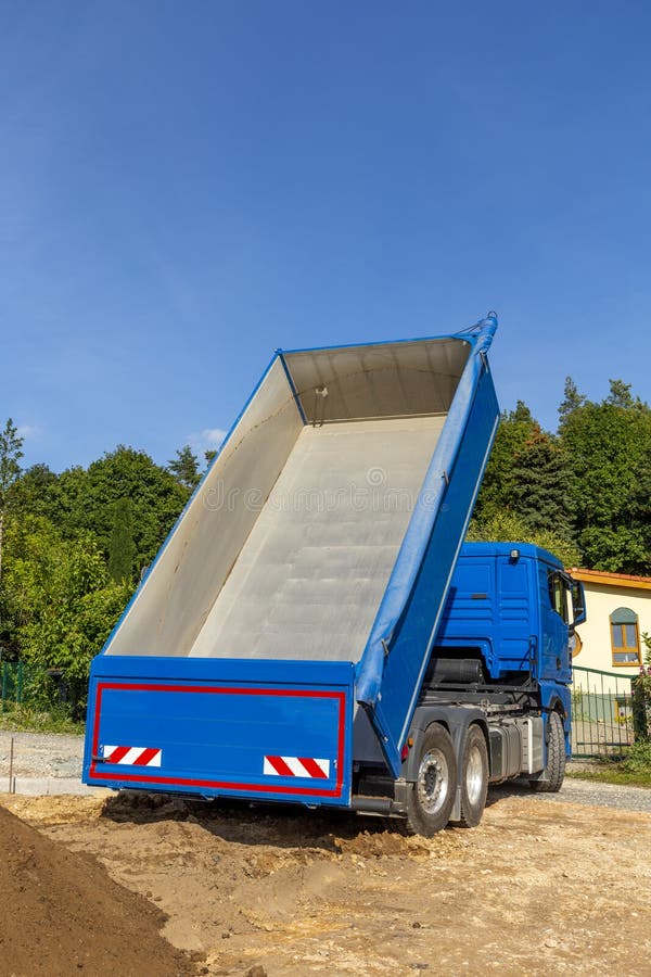 Unloading the Truck with Potting Soil from the Truck Bed at the ...
