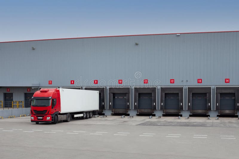 Unloading Trucks at a Modern Warehouse Complex Stock Photo - Image of ...