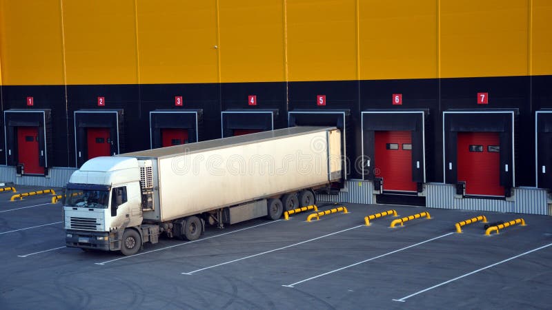 Unloading Trucks at a Modern Warehouse Complex Stock Photo - Image of ...