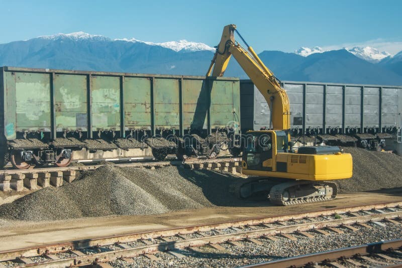 Unloading Unloading Rubble with an Excavator Wagons with Bulk Cargo ...