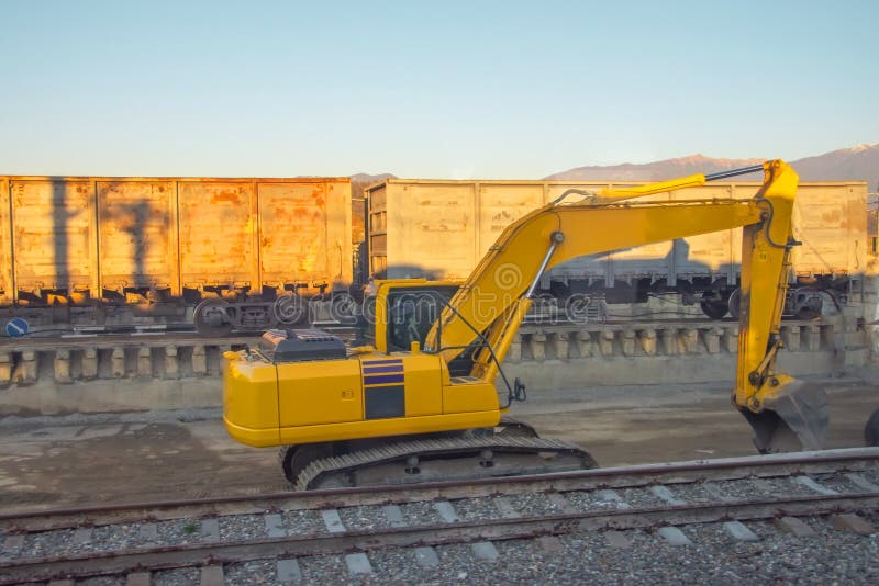 Unloading Unloading Rubble with an Excavator Wagons with Bulk Cargo ...
