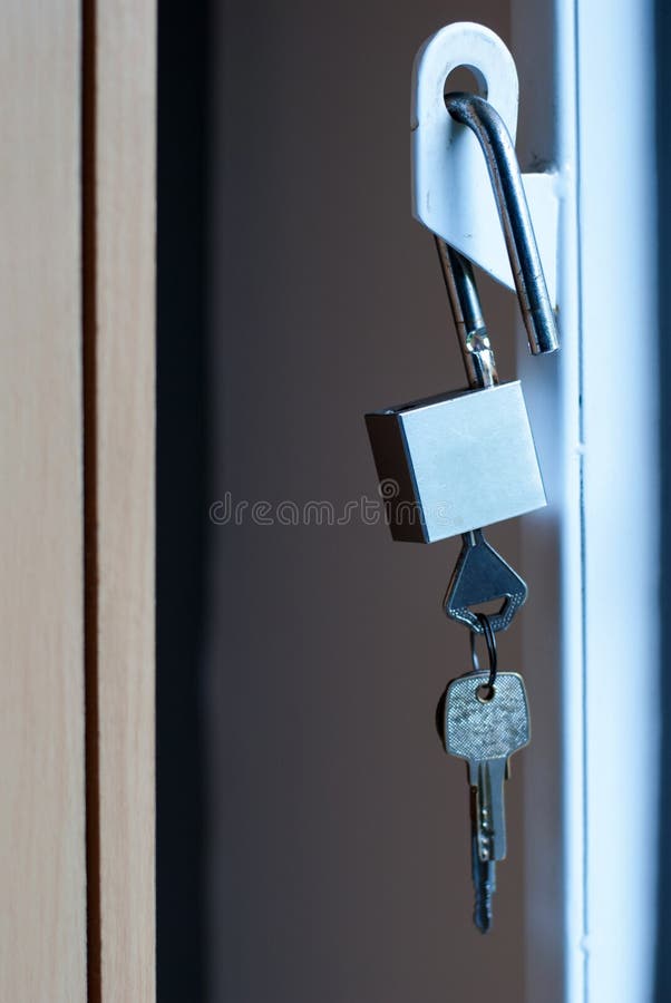 Unlocked Silver Padlock Hanging on the White Iron Door. Stock Photo ...