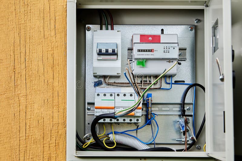 An Unlocked Wall-mounted Outdoor Electrical Panel with an Electricity ...