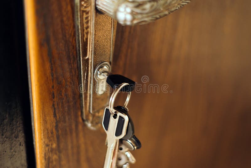 Unlocking a House Door with a Key on a Keyring Close Up. Old Door Stock ...