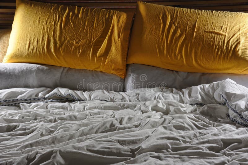 Unmade bed stock image. Image of pillow, blanket, orange - 45239397