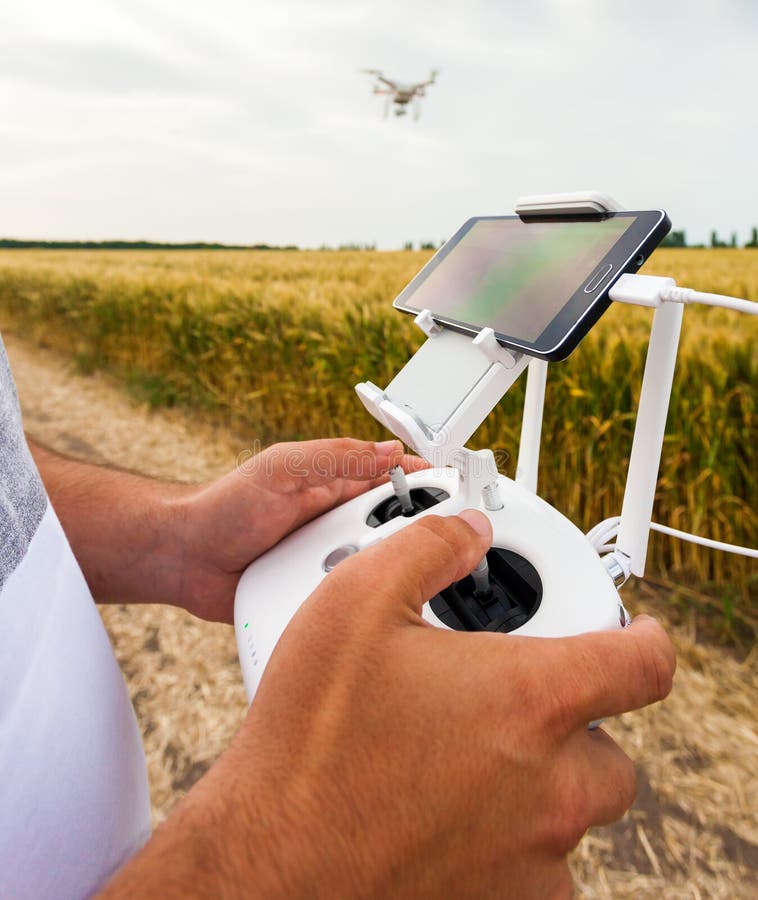 Unmanned Copter. Man Controls Quadrocopter Flight Stock Photo - Image ...