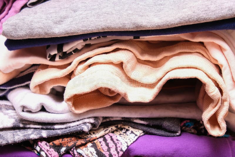 Unorganized Heaps of Clothes of Different Colors in a Wardrobe Lying in ...