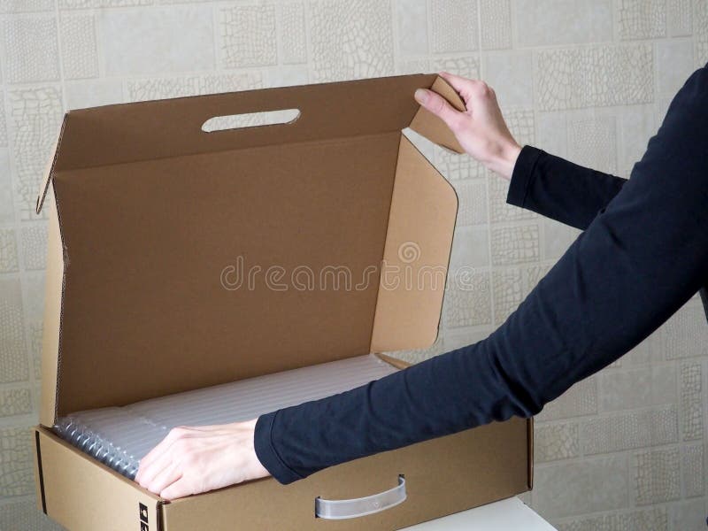 Unpacking a Delivered Parcel Stock Photo - Image of closeup, brown ...