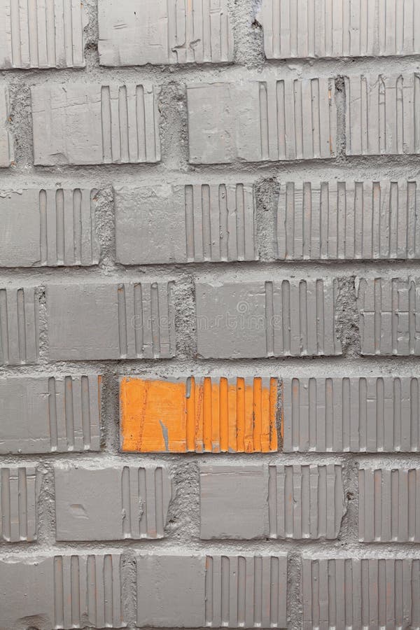 Unpainted Brick of Wall, One Orange Rectangle between Grey Blocks ...