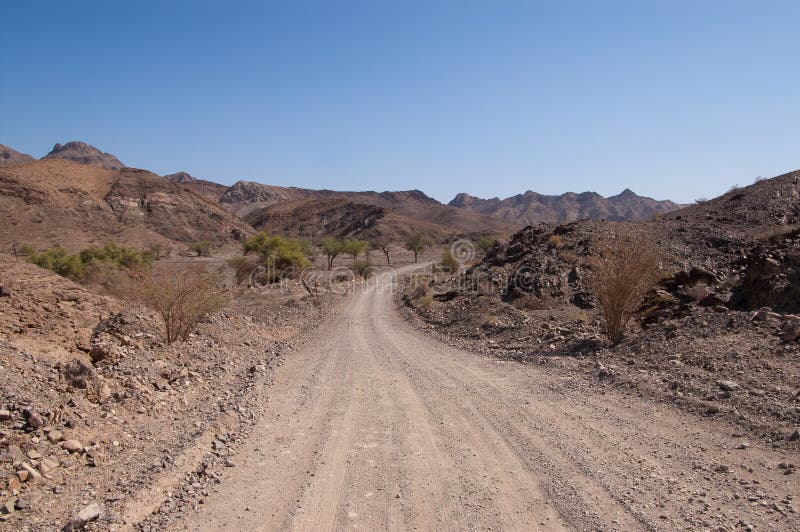 Unpaved Road Through Hills And Mountains. Stock Image - Image of ...