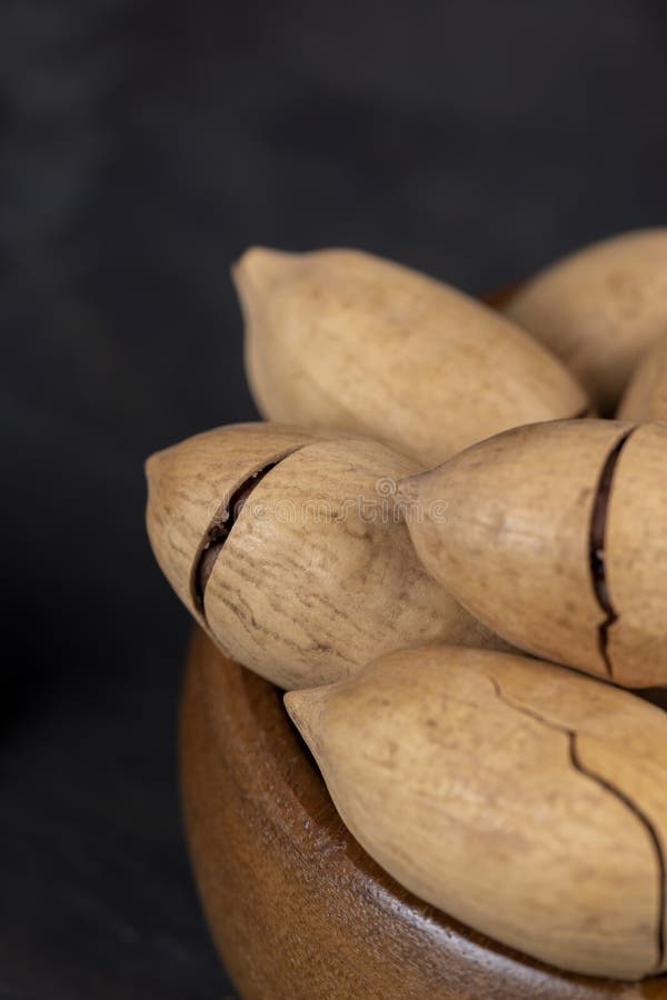 Unpeeled Pecans in a Shell on the Kitchen Table Stock Image - Image of ...