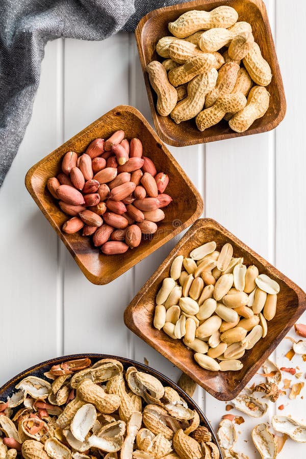 Unpeeled and Peeled Peanuts in Bowl on Kitchen Table. Top View Stock ...