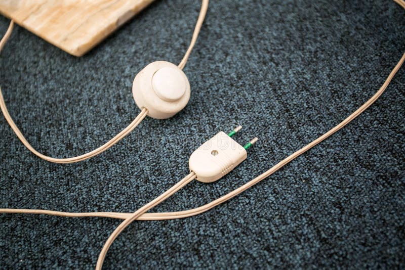 Unpluged Lamp Cable on the Carpet Floor. Old Lamp Cable Stock Image ...