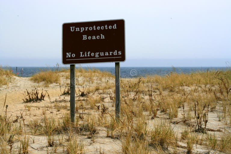 Unprotected Beach Sign - No Lifeguards Stock Image - Image of sandy ...