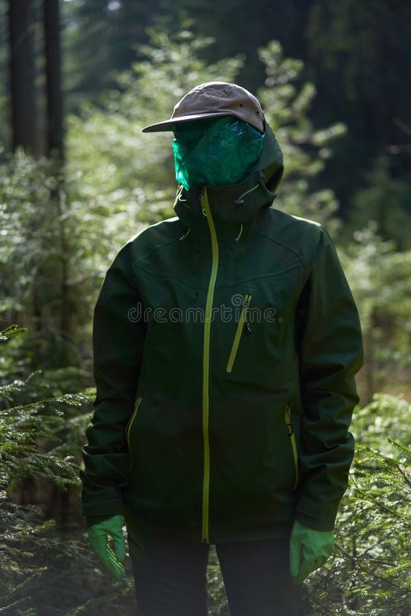 Unrecognizable Man in a Green Plastic Mask in the Forest As a Symbol ...