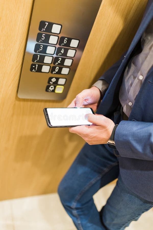 Unrecognizable Businessman Using Mobile Phone in Elevator Stock Image ...