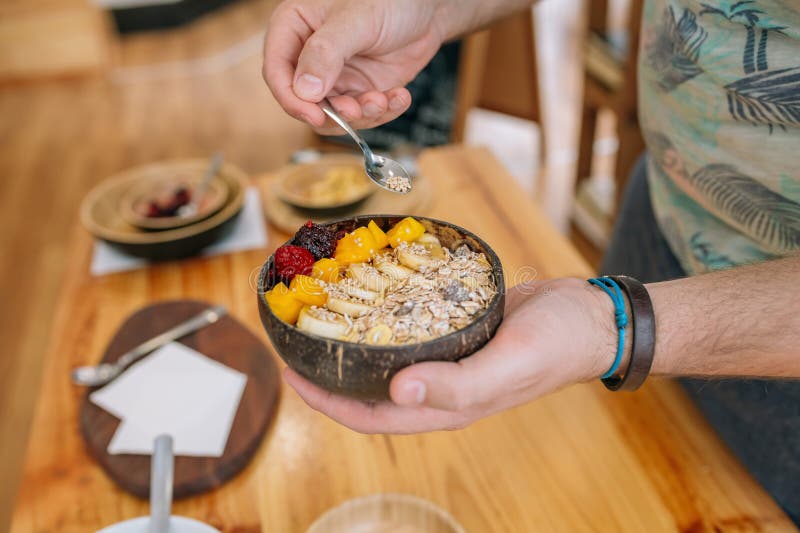 Unrecognizable Chef Adding Seeds To Exotic Fruit and Cereal Breakfast ...