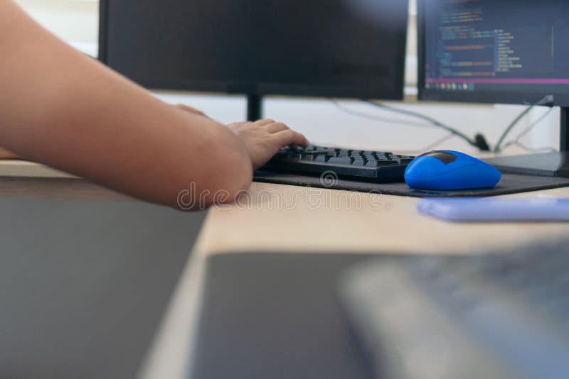 Unrecognizable Computer Programmer Sitting at Table at Home Working ...
