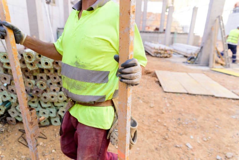 Unrecognizable Construction Worker Working on a Construction Site with ...