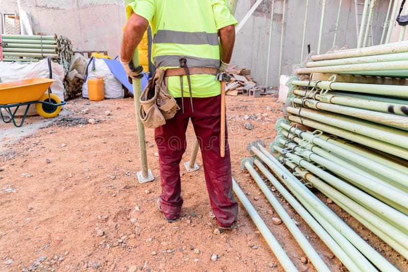 Unrecognizable Construction Worker Working on a Construction Site with ...