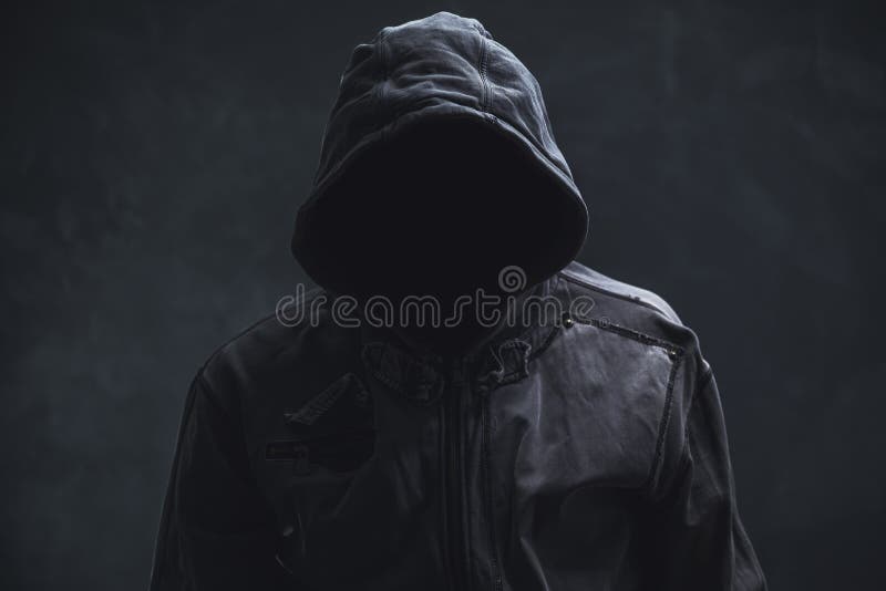 Unrecognizable Cyber Criminal or Computer Hacker Wearing Black Hooded ...