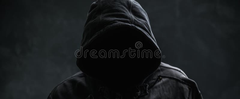 Unrecognizable Cyber Criminal or Computer Hacker Wearing Black Hooded ...