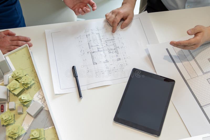 Designer Hands Working on Blueprint Design on Table with Digital Tablet ...