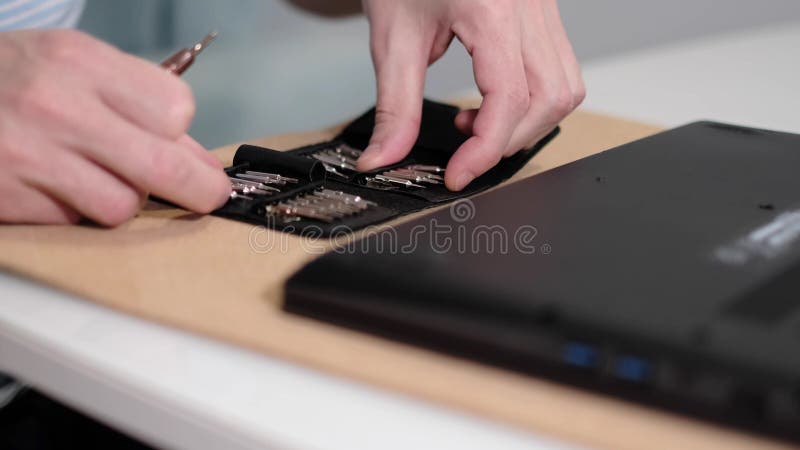 Unrecognizable Engineer Separating Computer from Case. Electronic ...