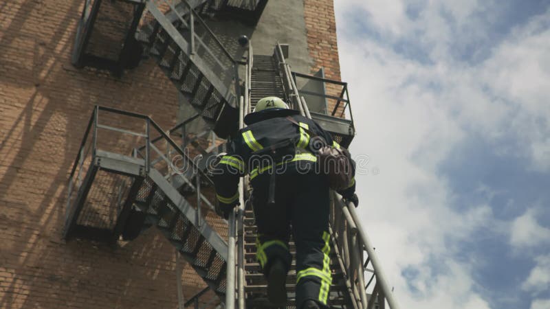 Firefighter Looking at Camera in Burning Hallway Stock Footage - Video ...