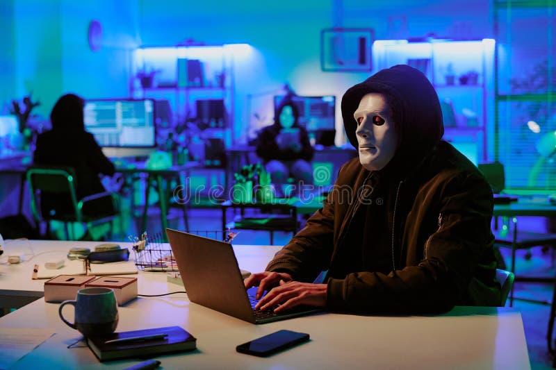 Unrecognizable Hacker at Table Stock Photo - Image of unrecognizable ...