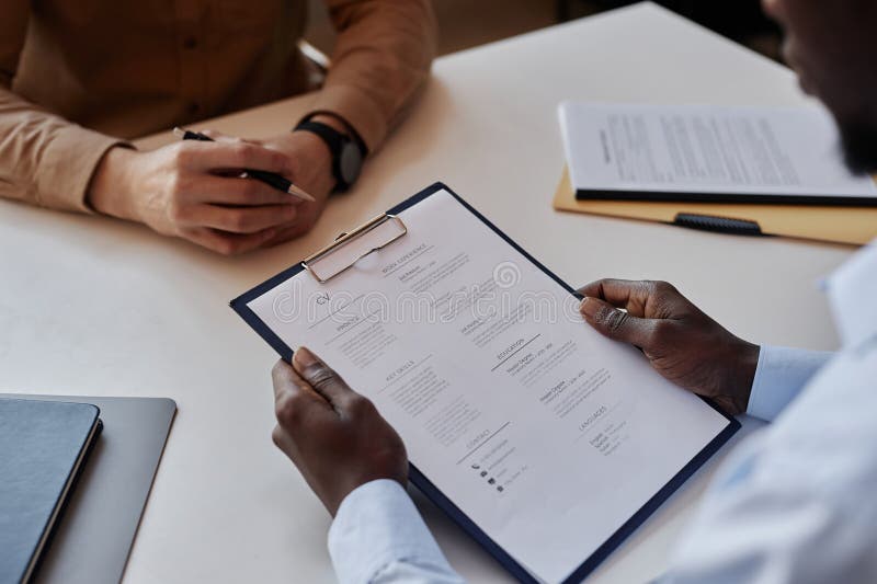Unrecognizable HR Recruiter Reading CV during Job Interview Stock Photo ...