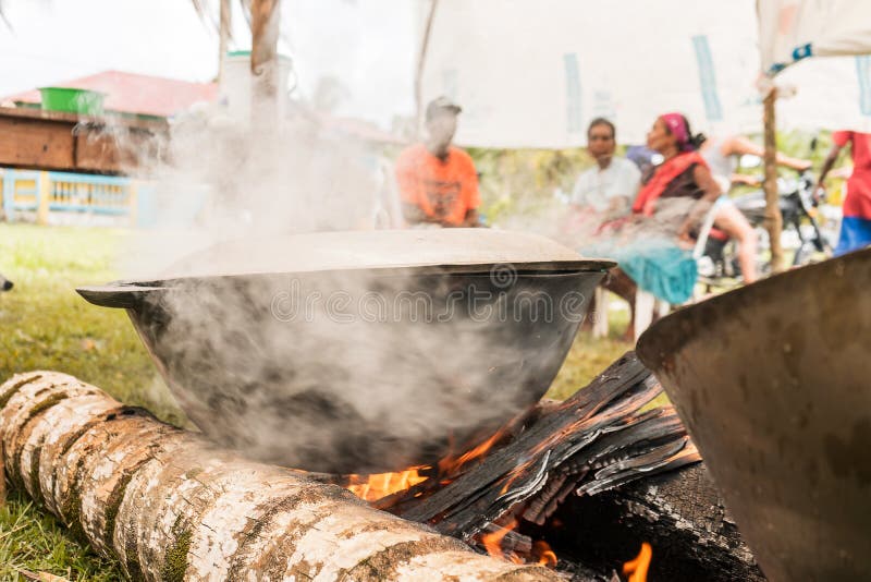 Unrecognizable Indigenous People Preparing a Broth Over a Pot on a ...